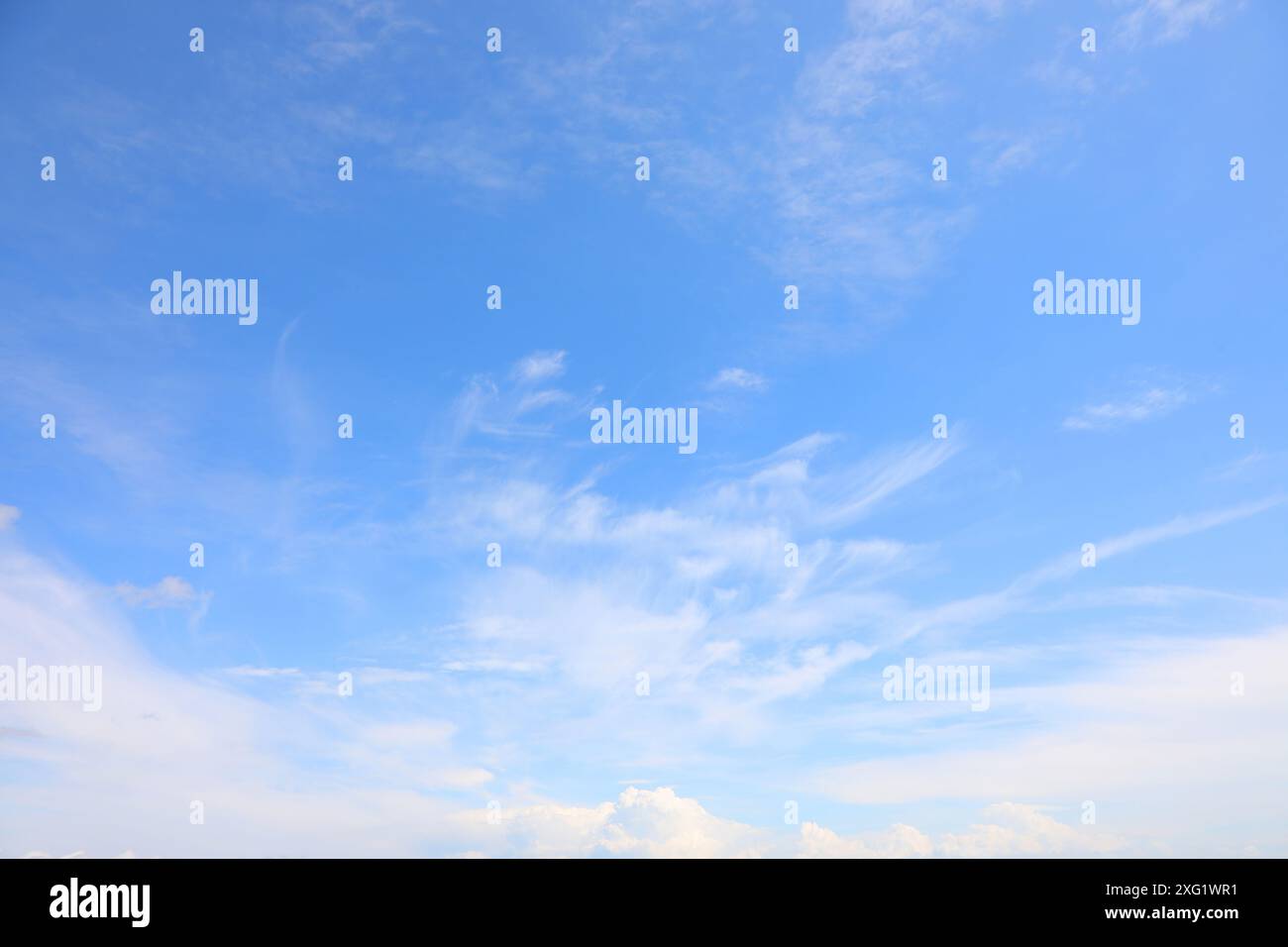 Vast expanse of azure sky with fluffy white clouds symbol of purity and ...