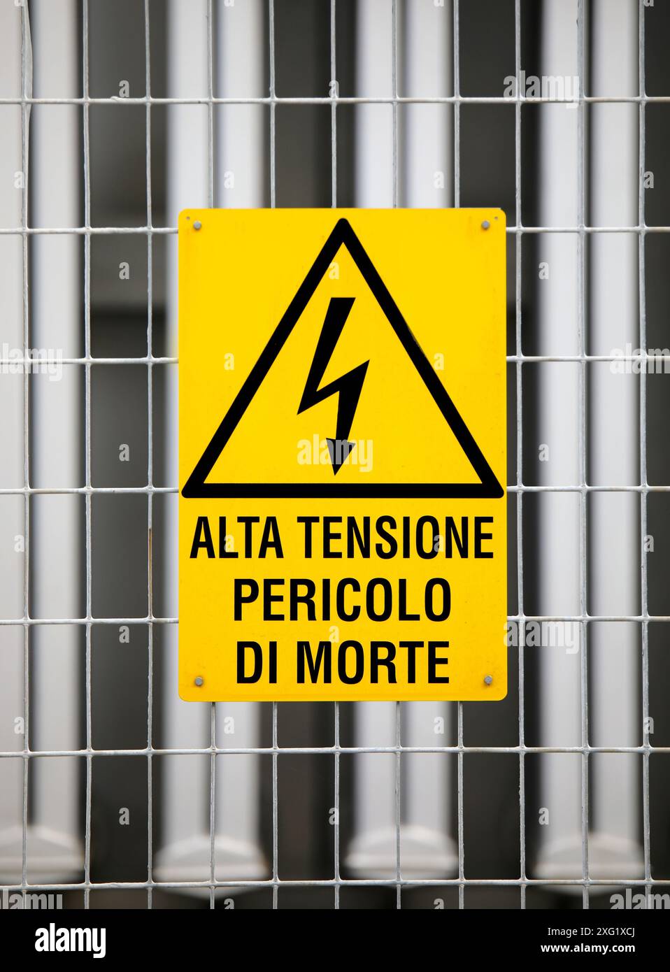 Yellow power plant warning sign with text in Italian that means HIGH ...