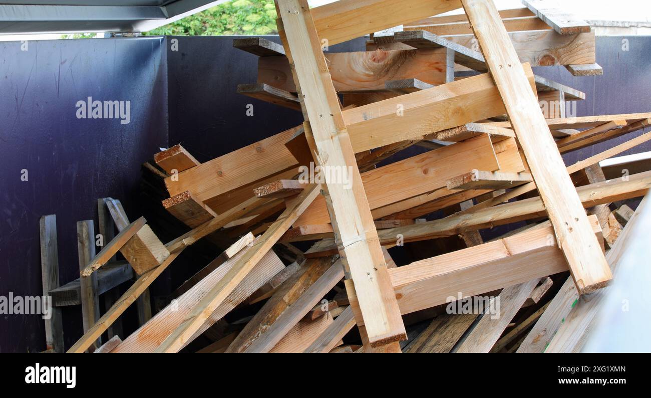 industrial waste container filled with wooden pallets ready for ...