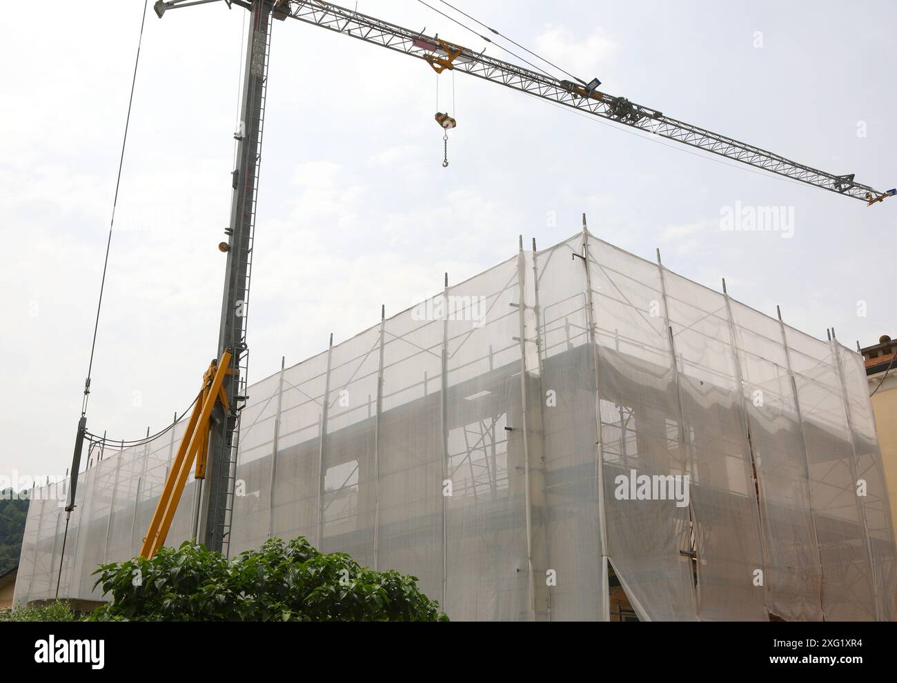 Construction site during the building of a structure with scaffolding ...