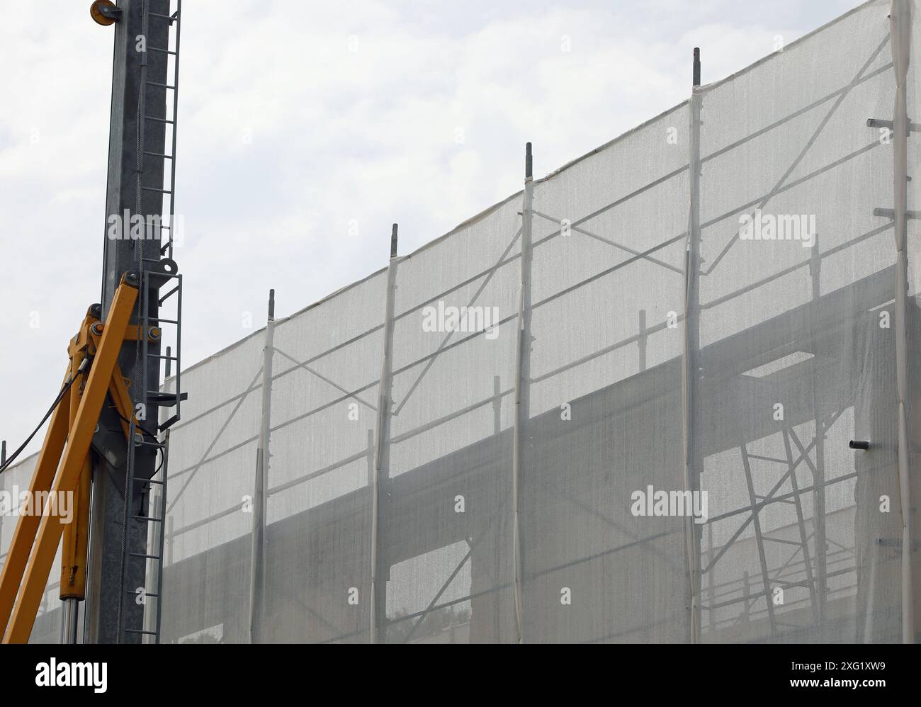 Construction site during building maintenance with scaffolding and a ...
