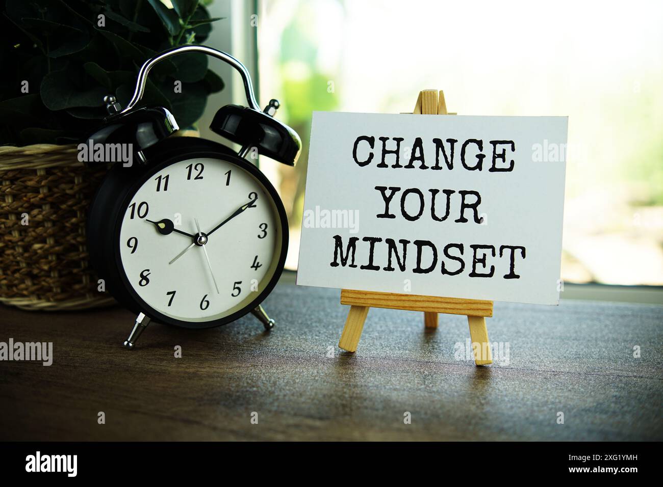 Change your mindset text message on paper card with wooden easel on ...