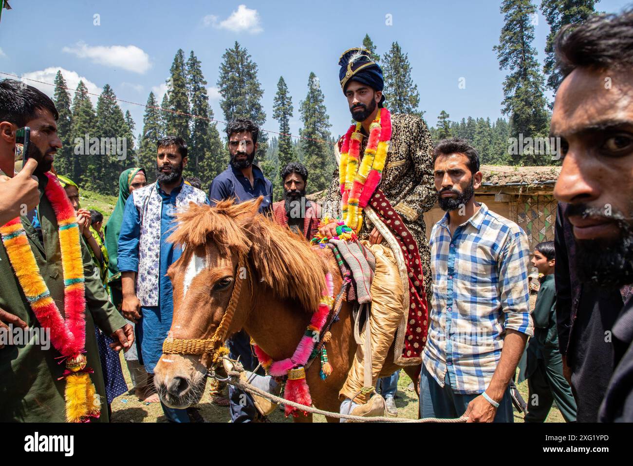 Friend and relatives take photos of a Gujjar (nomad) groom before ...