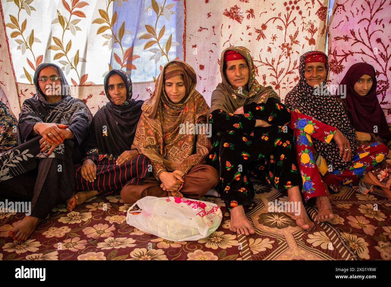 Gujjar (nomad) women attend a marriage ceremony at Sangerwani village ...