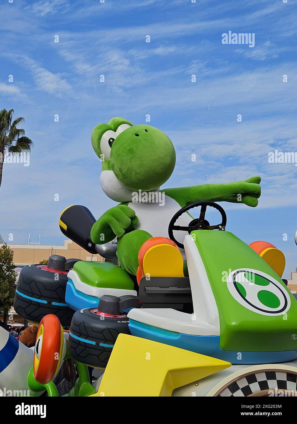 Osaka, Japan – Dec. 11, 2023: Yoshi welcomes the visitors from his kart ...