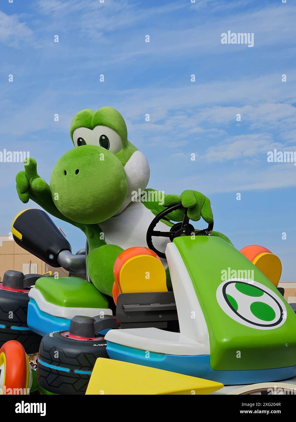 Osaka, Japan – Dec. 11, 2023: Yoshi welcomes the visitors from his kart ...