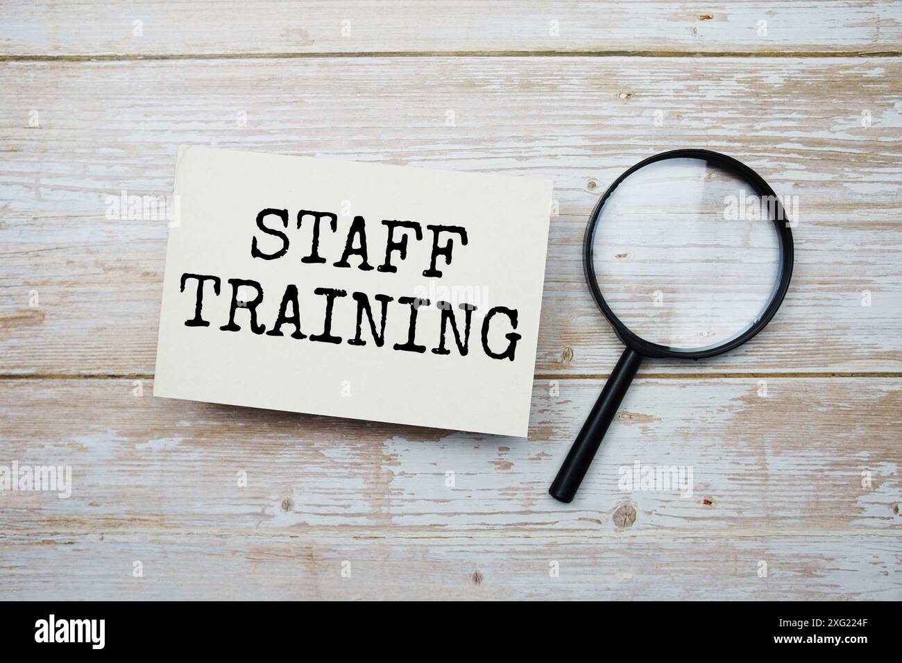 Staff Training text message and magnifying glass with space copy on ...