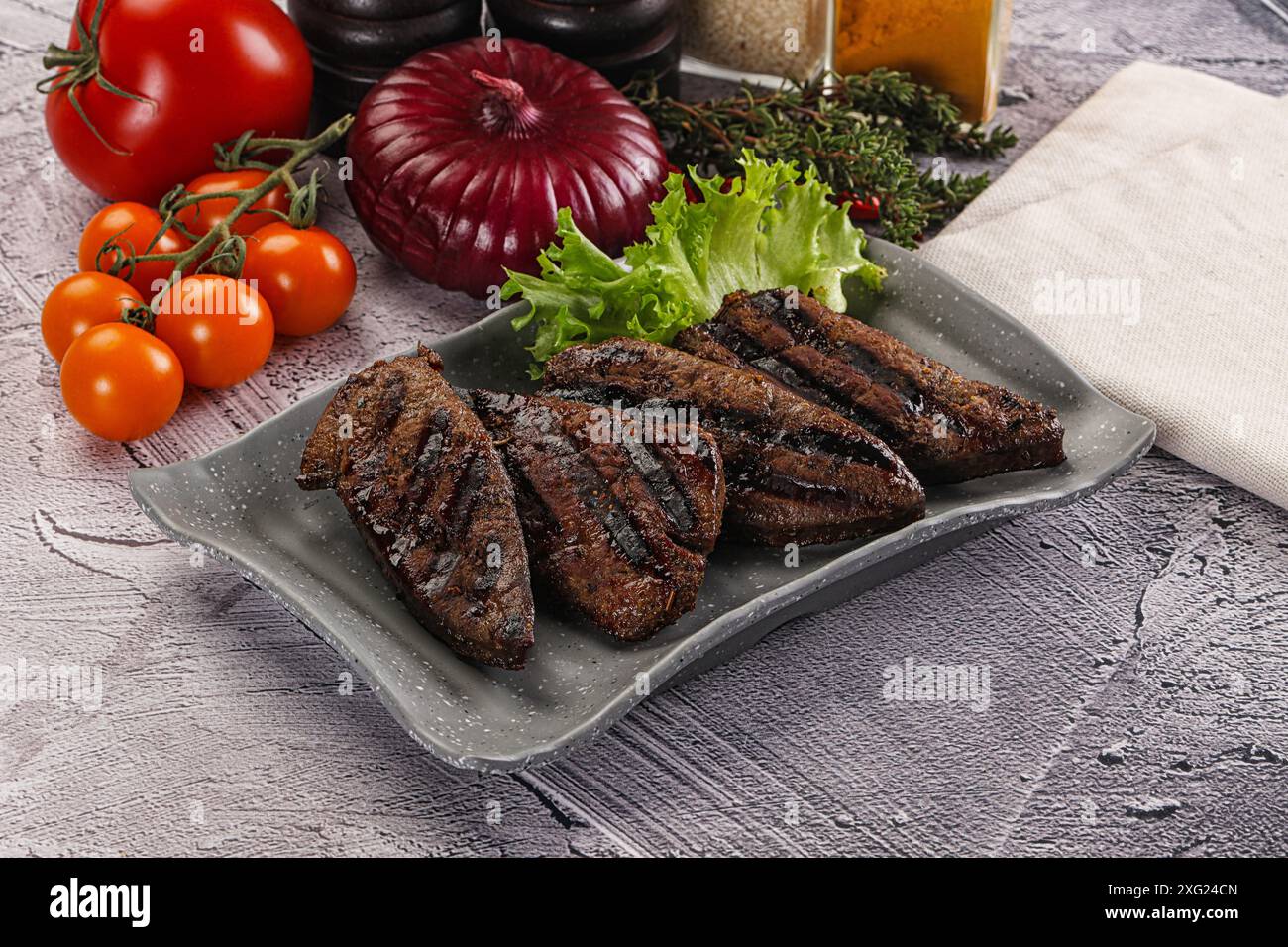 Grilled diet beef liver steak in the plate Stock Photo - Alamy