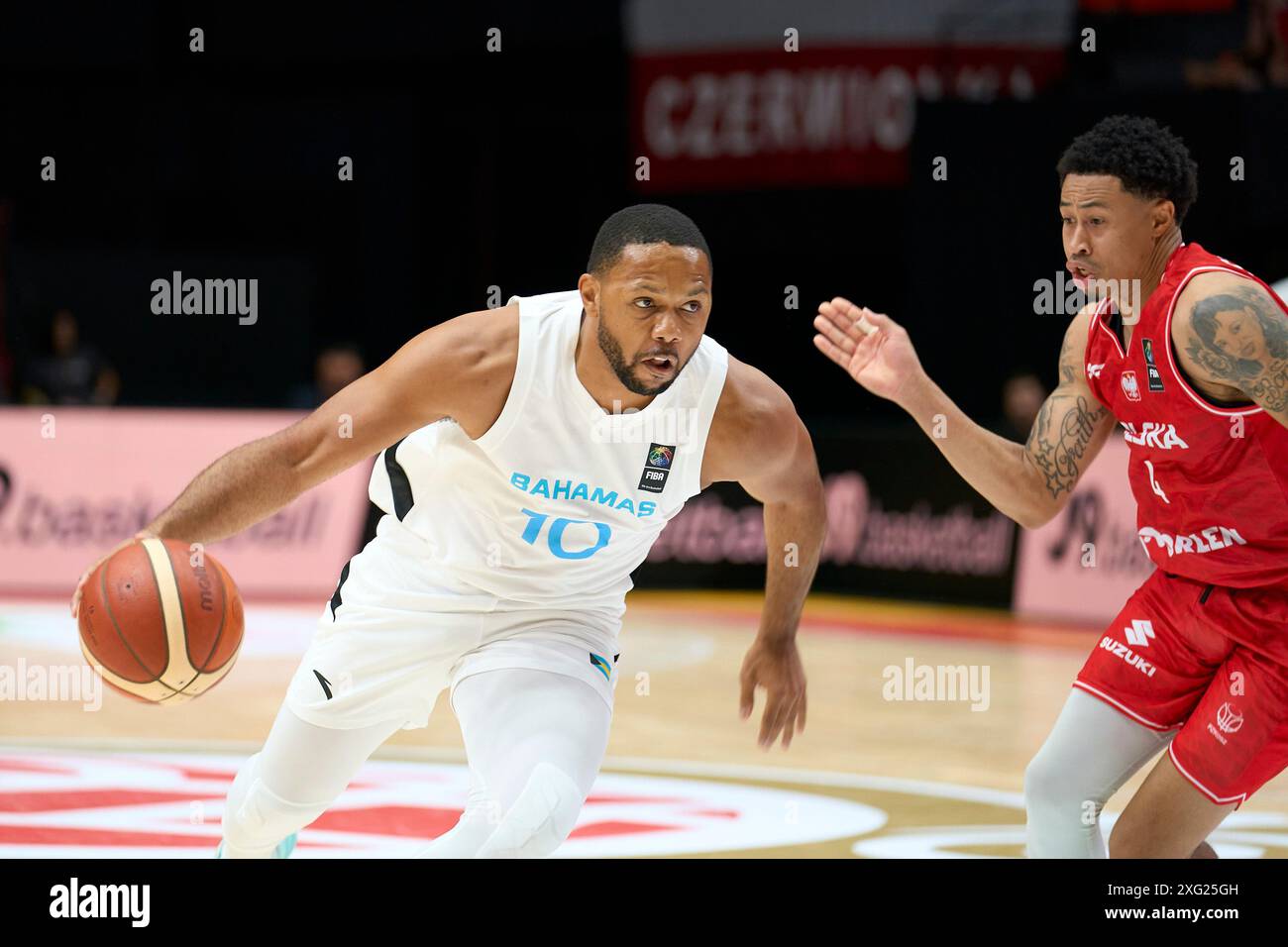 Eric Gordon from Bahamas team, AJ Slaughter from Poland team seen in ...