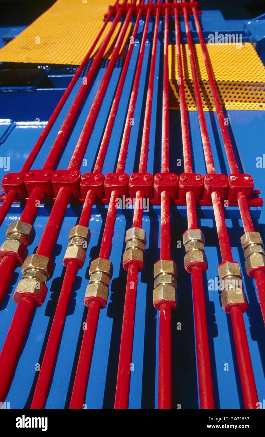 Recycling industry. Hydraulic press at waste sorting plant. Oil pipes ...