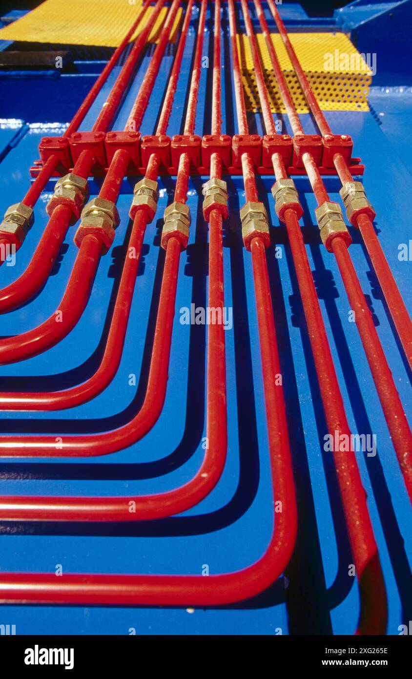 Recycling industry. Hydraulic press at waste sorting plant. Oil pipes ...