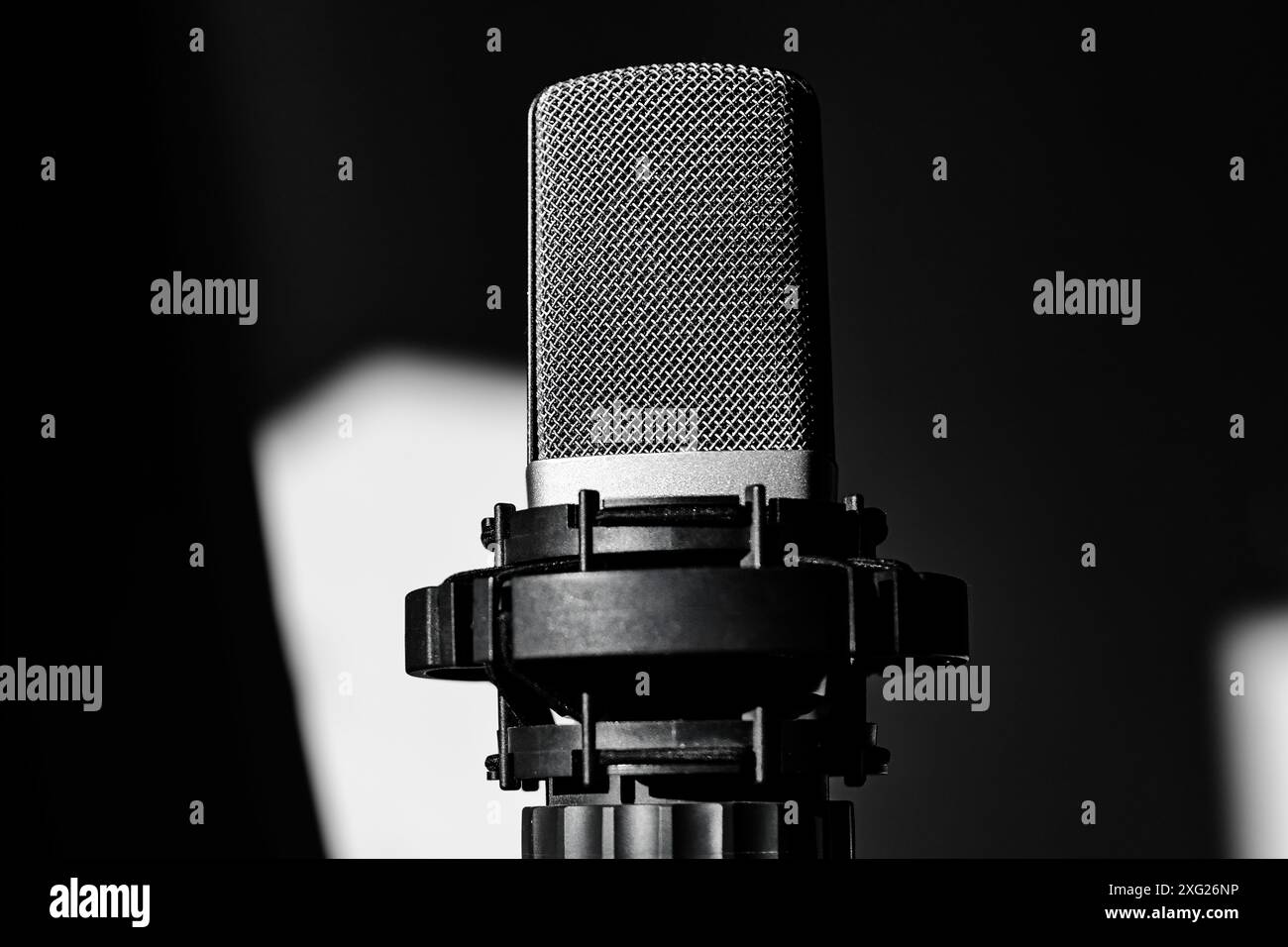 Monochrome image of a microphone in black and white. The microphone is ...