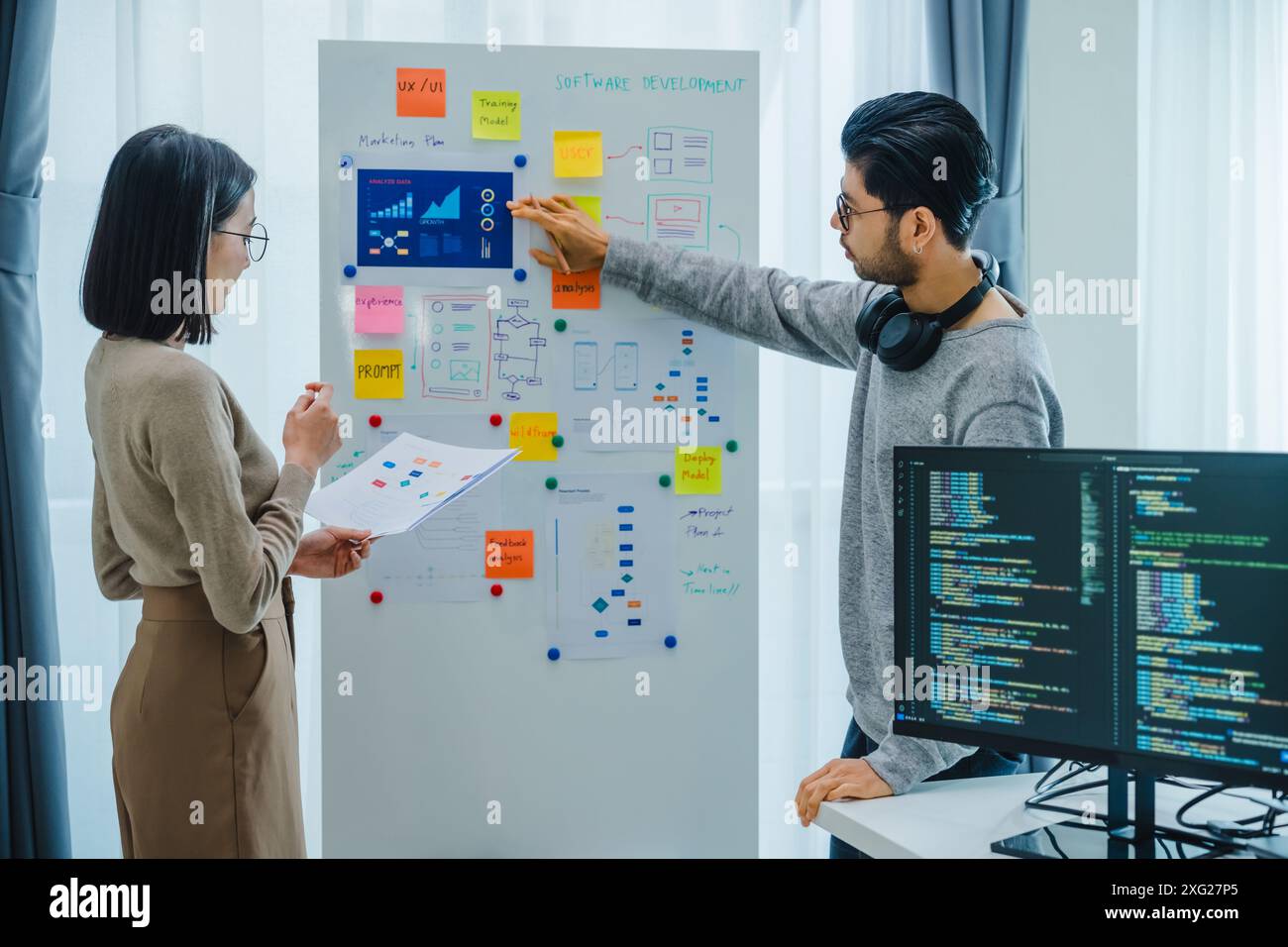 Developer team present project interface design with board and solving problem at office Stock ...