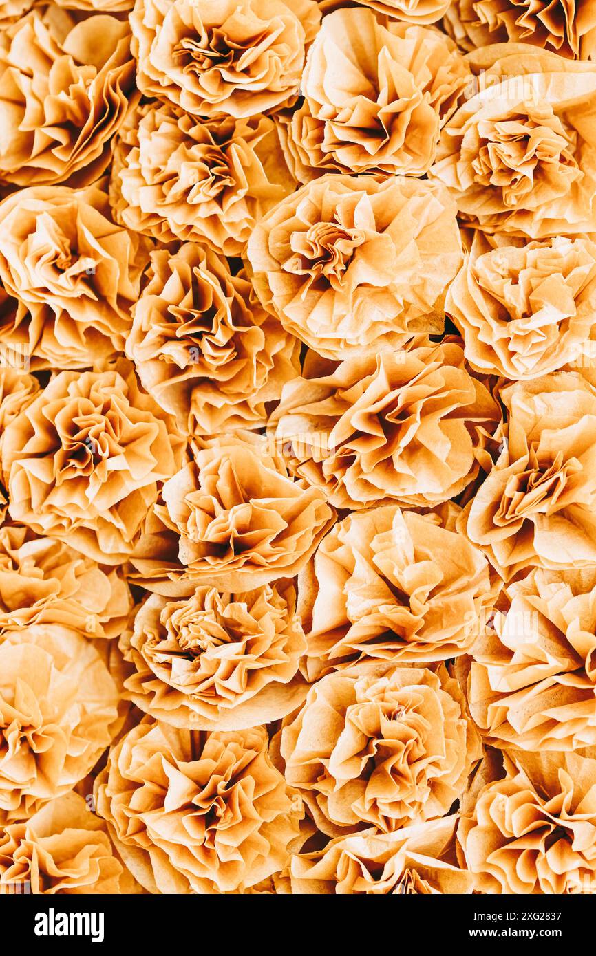 Handmade orange crepe paper flowers to decorate a float in a party ...