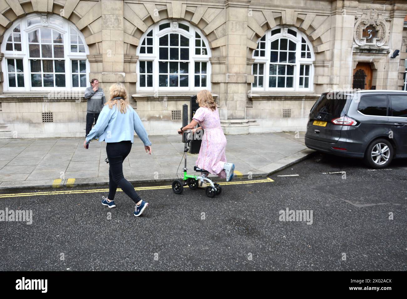 Sophie Rayworth who fractured her ankle, makes her way to Millbank ...