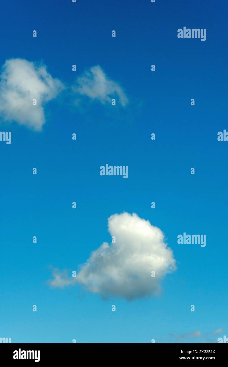 Small cloud in a blue sky Stock Photo - Alamy