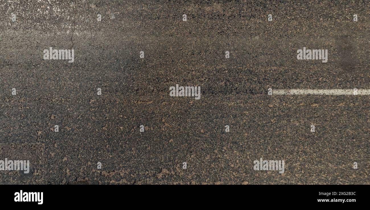 view from above on texture of asphalt road with cracks Stock Photo - Alamy