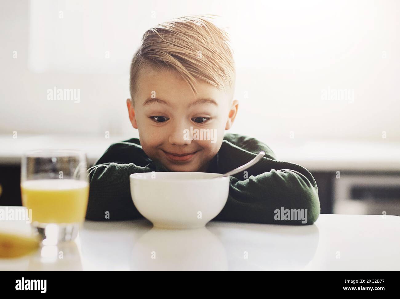 Boy child, breakfast and excited for morning in kitchen for nutrition ...