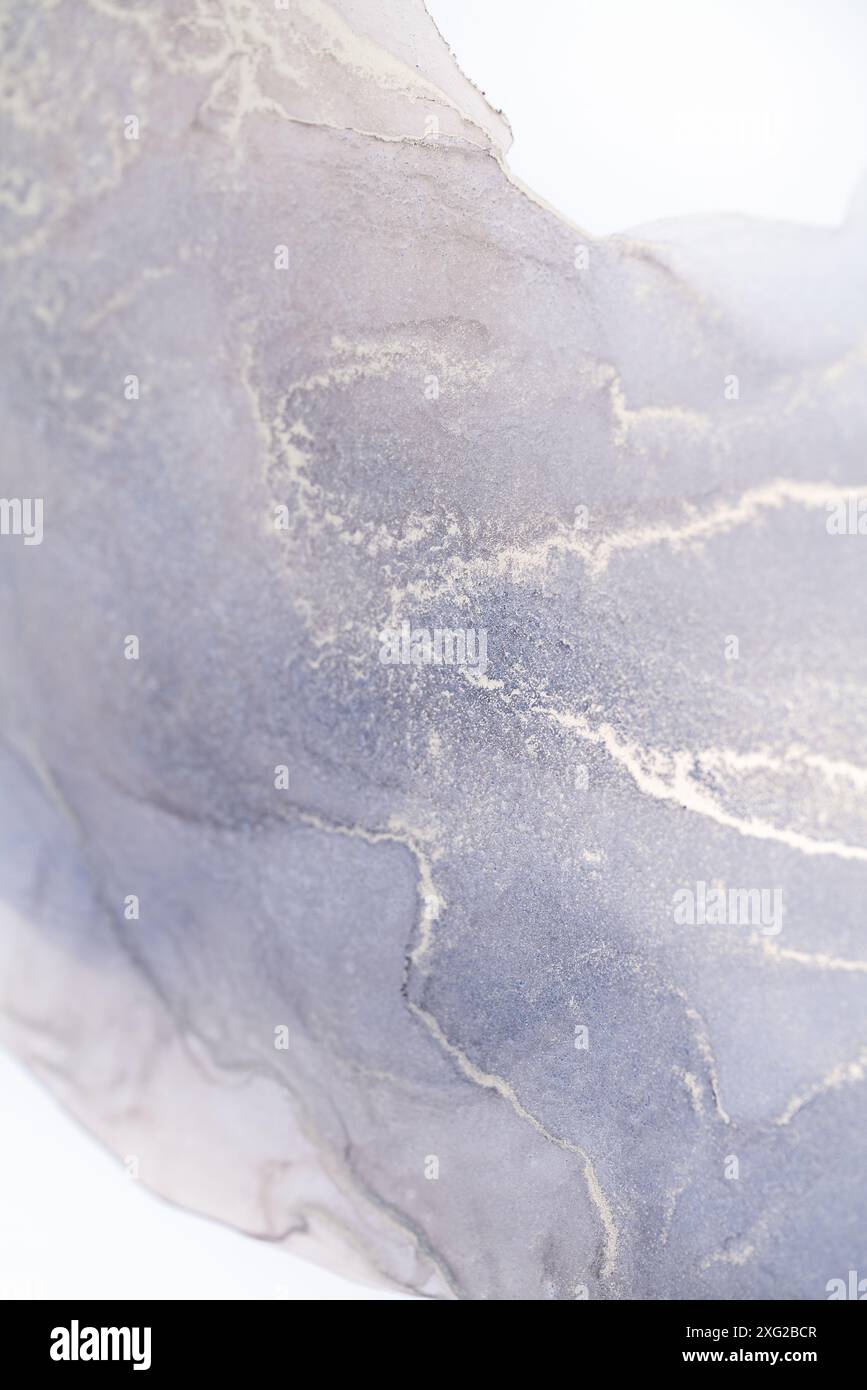 A close-up shot of a lavender and white ink swirl, showcasing the ...