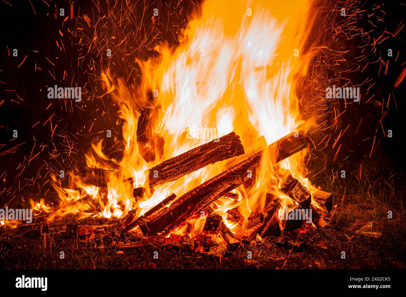 sparks and hot embers, campfire burns brightly on a summer night Stock Photo - Alamy