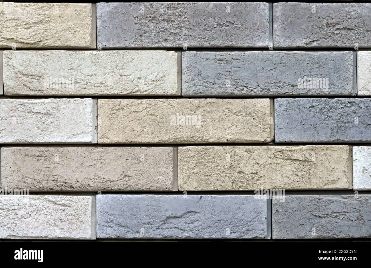 Wall from big size beige decorative bricks horizontal photo front view ...