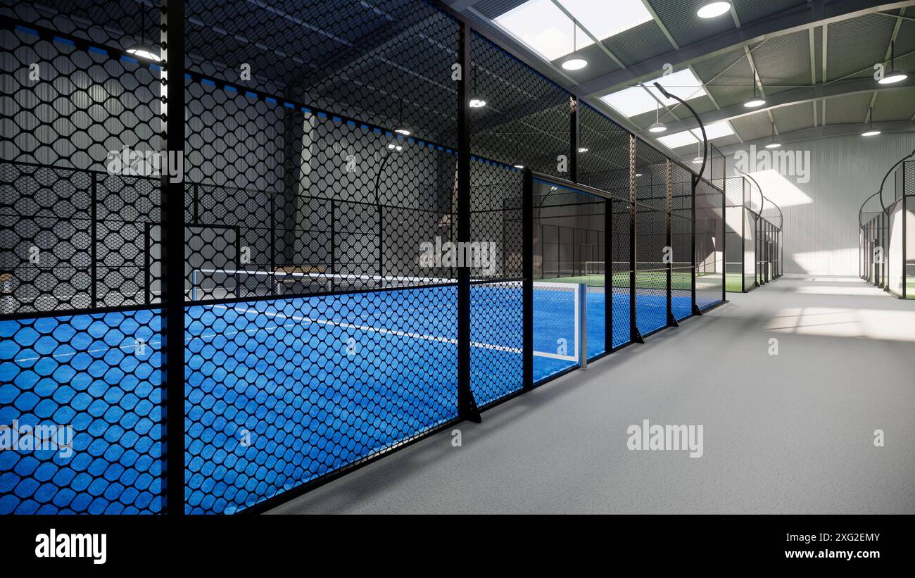 side view of blue padel tennis courts inside a warehouse building ...