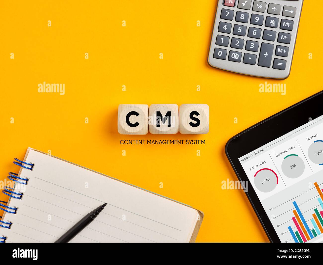 Content management system concept. The acronym CMS on wooden cubes over ...