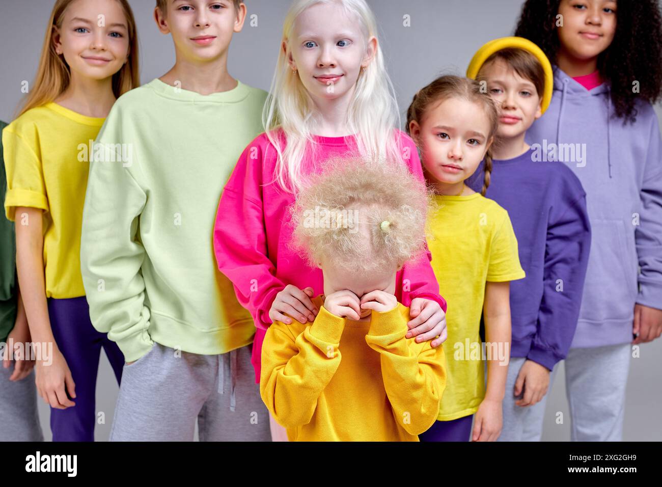 upset unhappy little girl crying wiping her eyes, her multiethnic ...