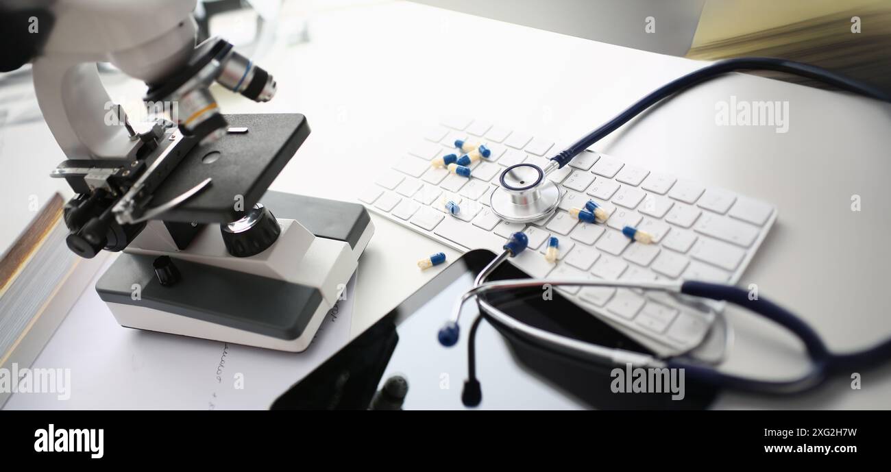Doctor desk with mess and chaos on surface, stethoscope tool, scattered ...
