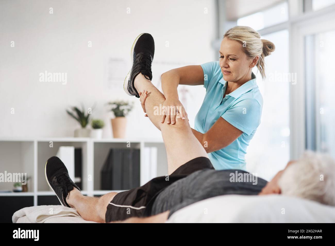 Physical therapy, patient and stretching knee for medical consultation, exam and assessment of ...