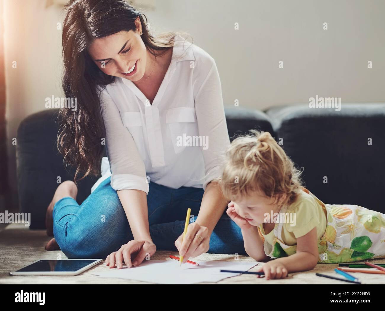 Mother, toddler and crayons for drawing in home, learning and studying ...