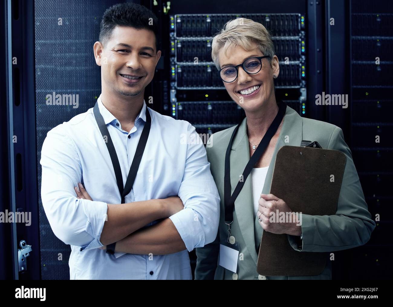 Computer center, mature woman and data engineer with clipboard ...