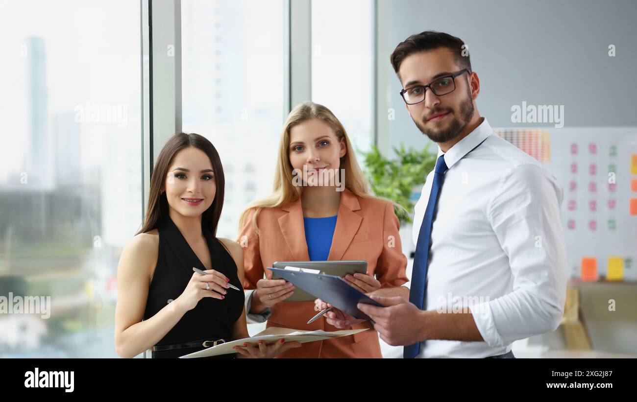 Confident team of successful people, men and women employees pose for ...