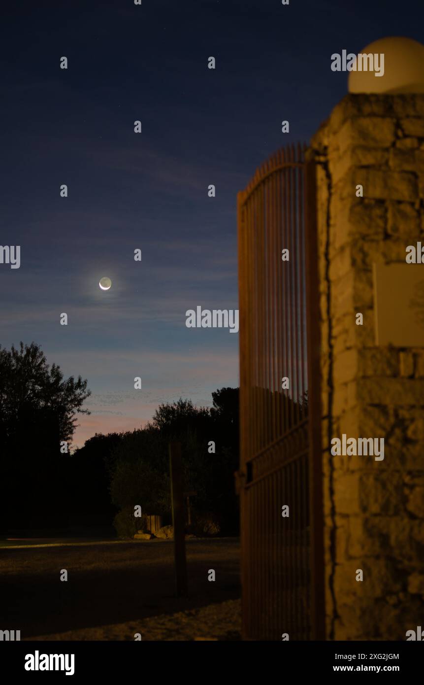 Moonlight Gate: A Glimpse Beyond Stock Photo - Alamy