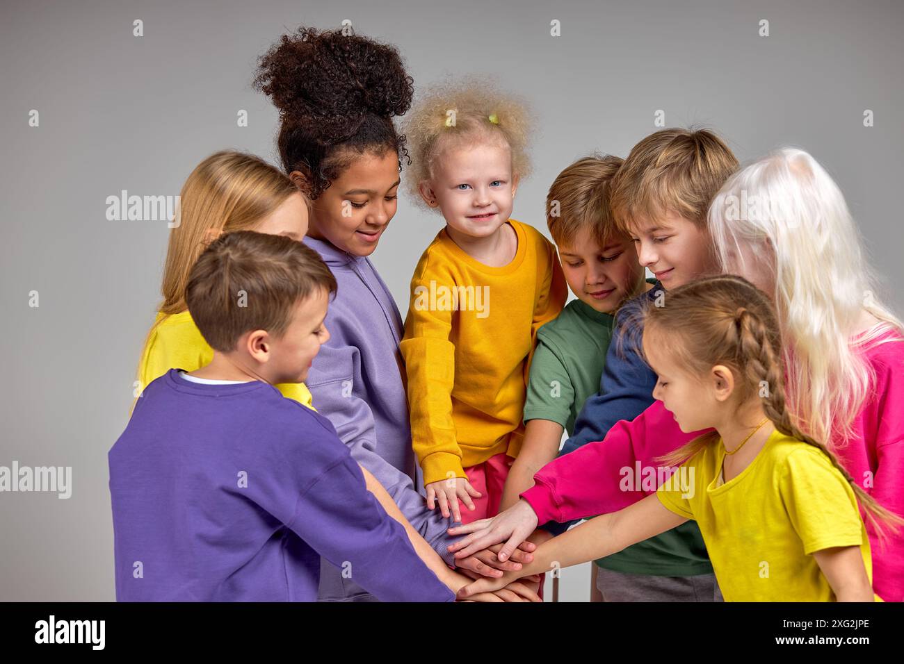 Group of smiling kids are ready to support and help each other isolated ...