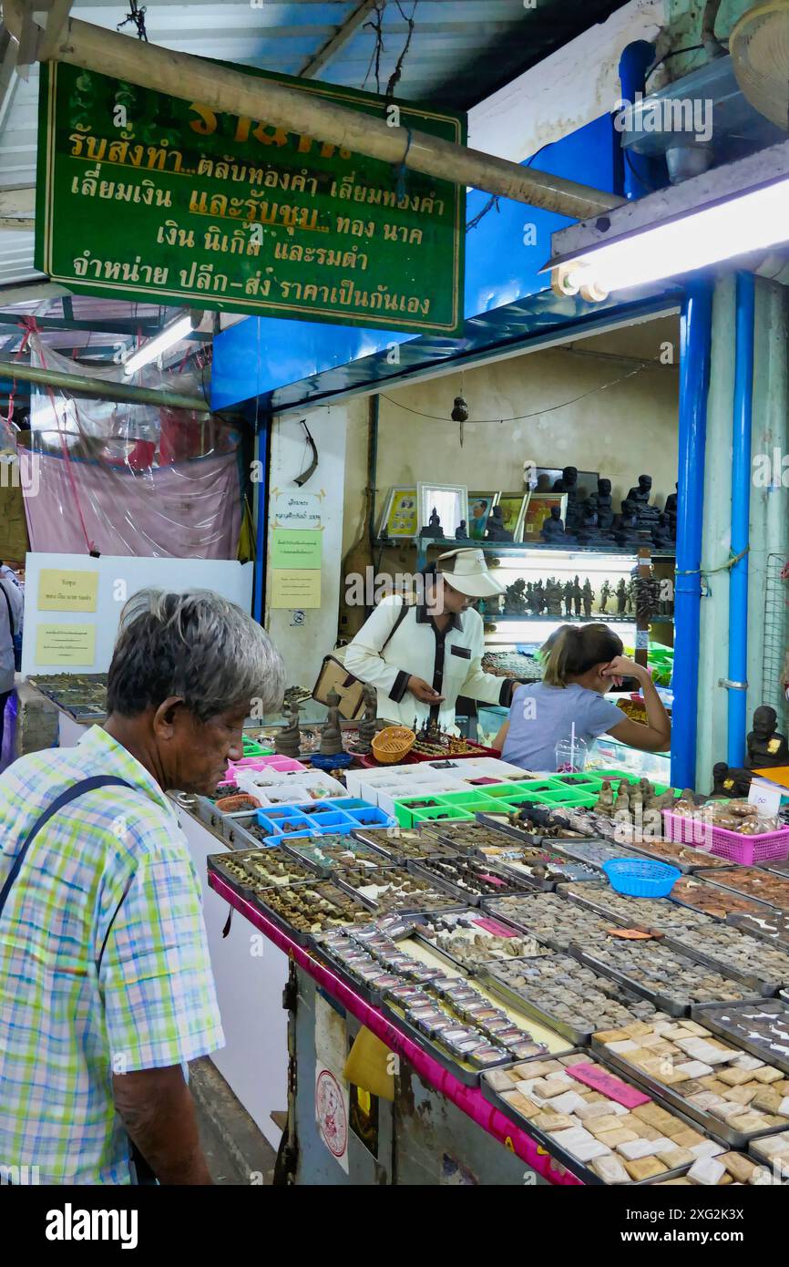 BANGKOK, THAILAND - Indoor market stall selling Buddhist ornaments with ...