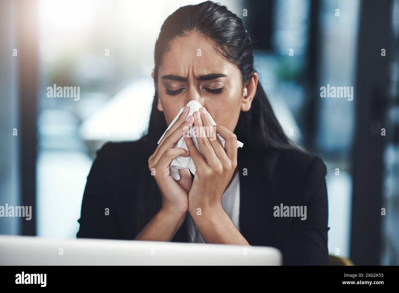 Woman, hay fever and blowing nose in office with tissue, flu or cold as ...