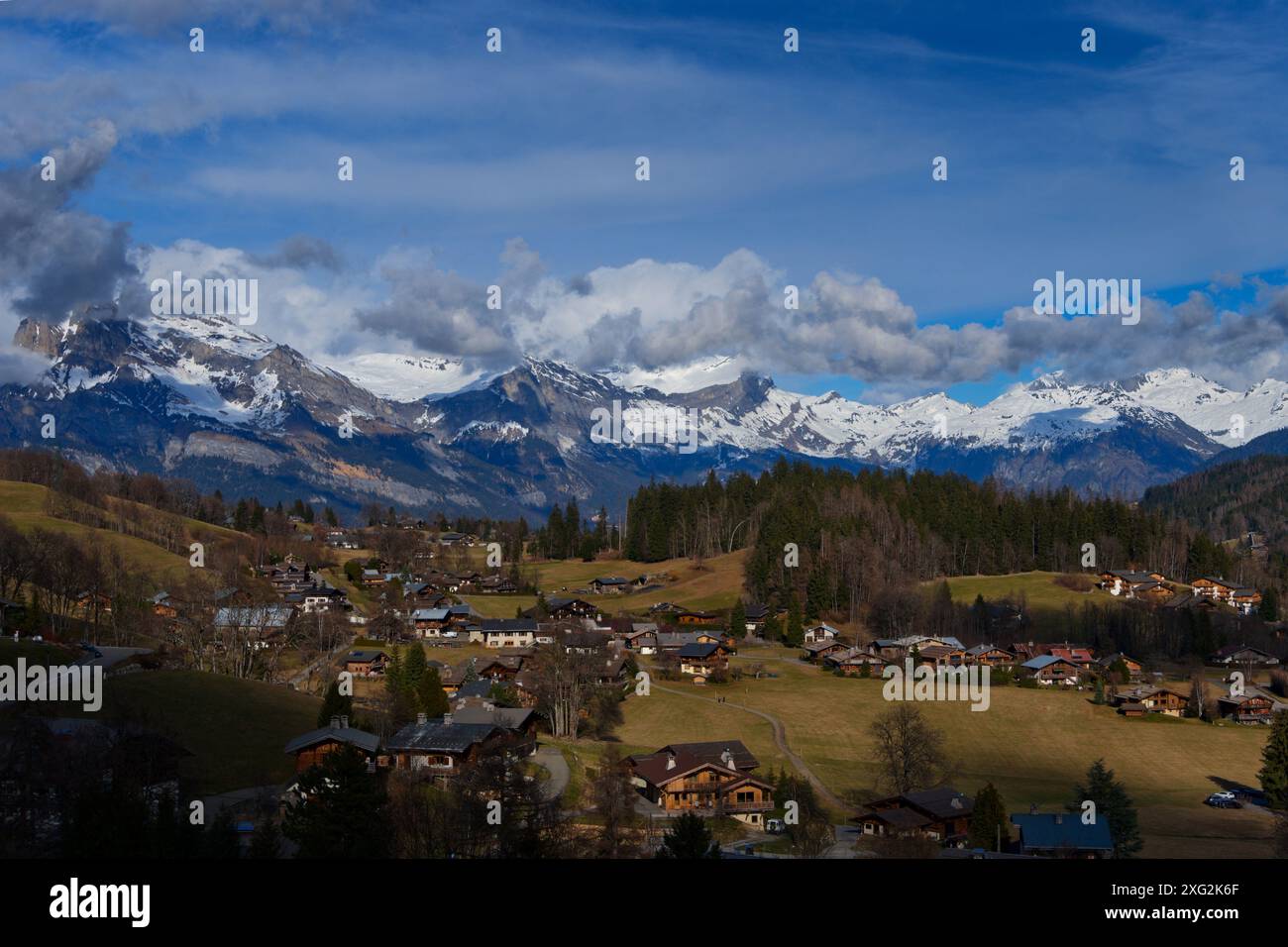 Alpine landscape with natural light and colors and clouds above the ...