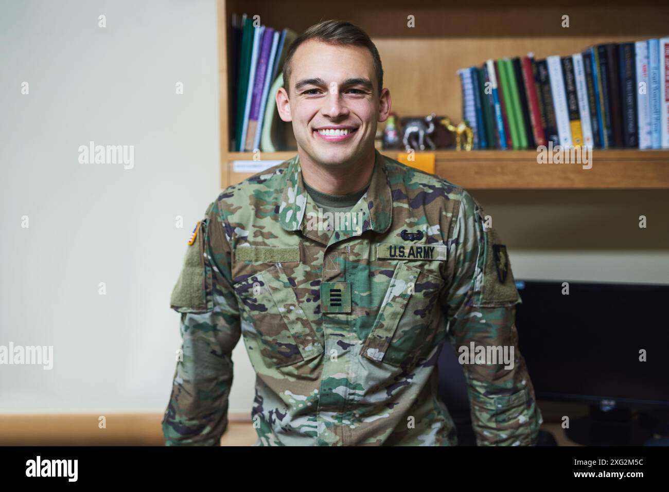 Soldier man, smile and portrait for service in bedroom at academy ...