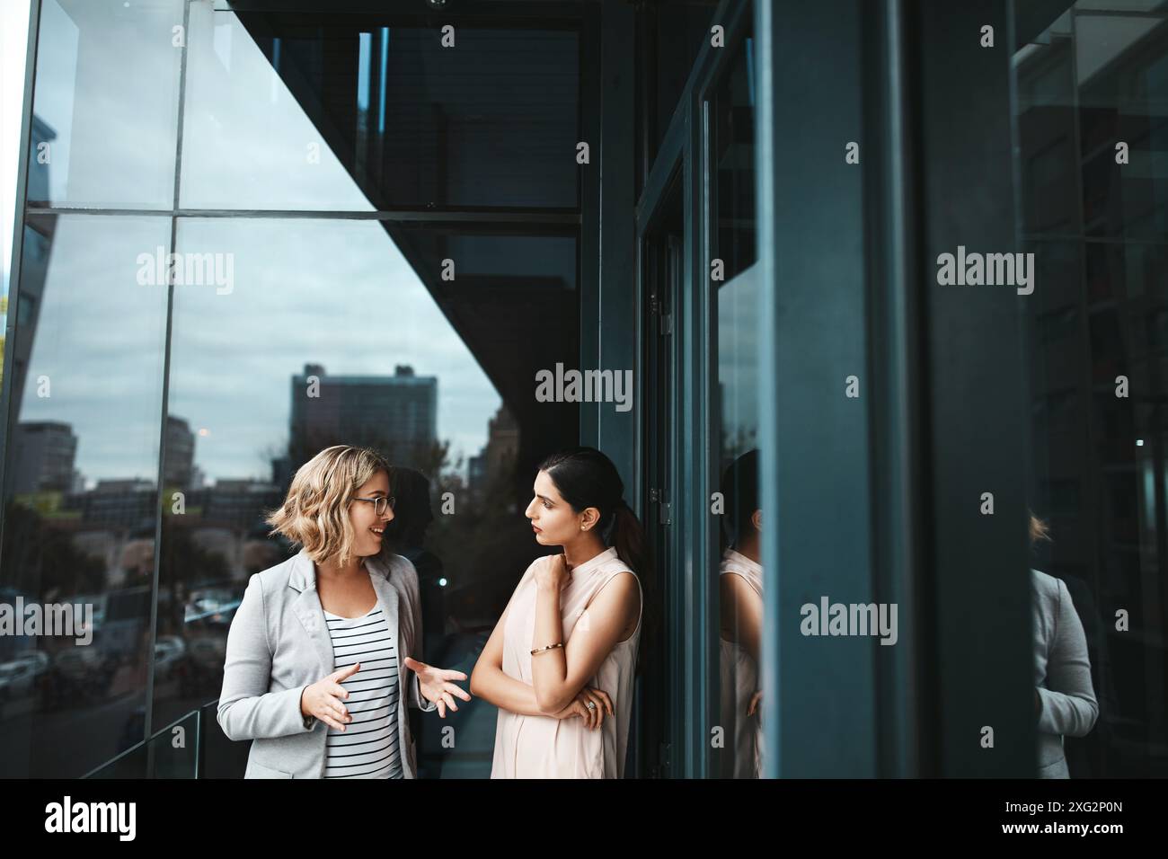 Office, balcony and business women for listening, planning and teamwork ...