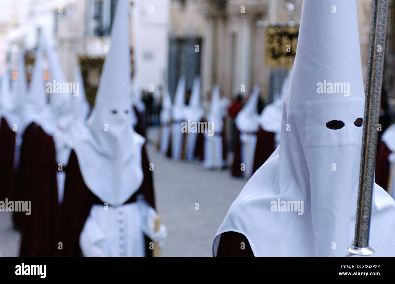 Hermandad del Santo Entierro penitents at procession during Holy Week ...