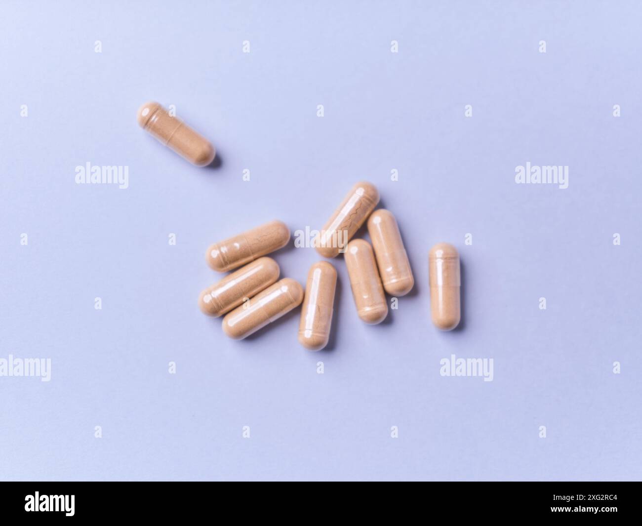 Ashwagandha (Withania somnifera) capsules. Paper background. Soft focus ...