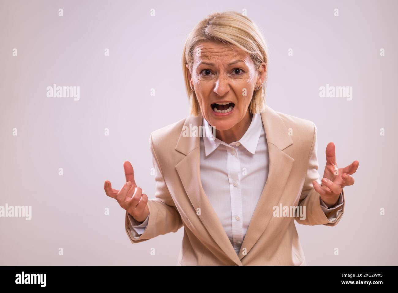 Angry furious elderly businesswoman hi-res stock photography and images ...