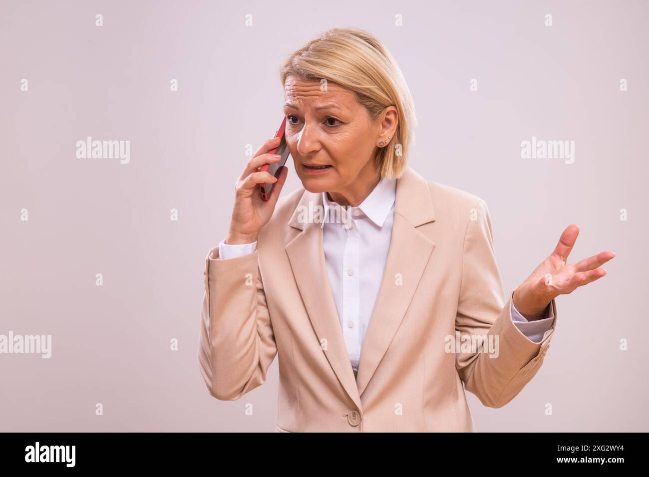 Senior woman phone angry hi-res stock photography and images - Alamy