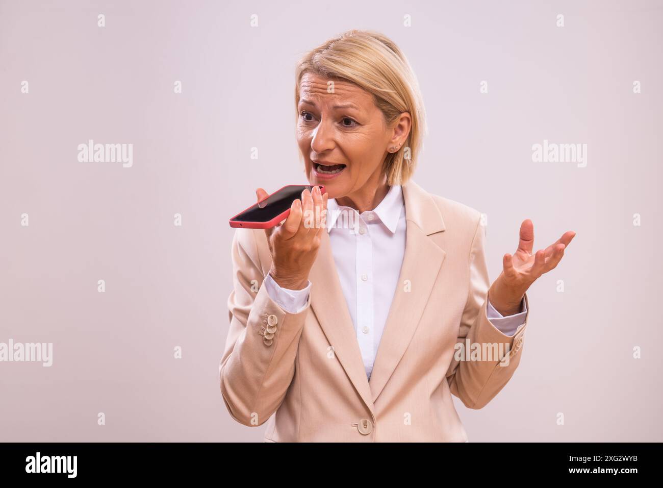 Senior woman phone angry hi-res stock photography and images - Alamy