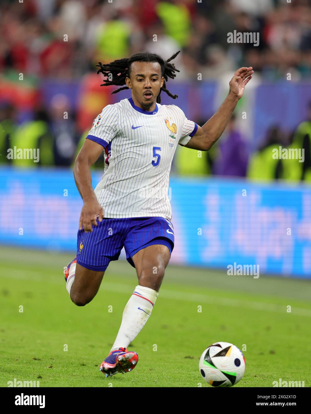 HAMBURG, GERMANY - JULY 05: Jules Kounde of France runs with the ball ...