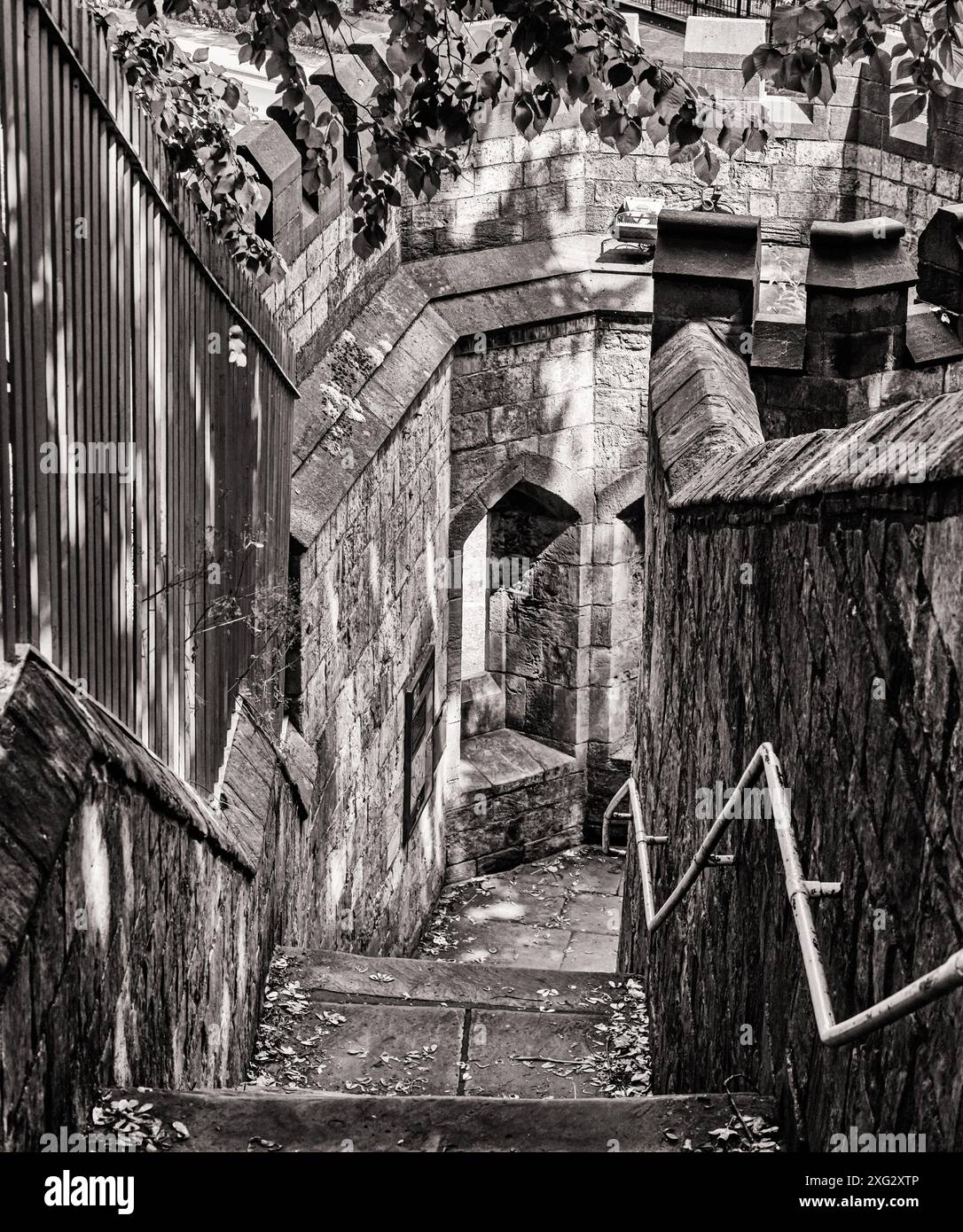 Internal section of a historic city wall. Steps lead downwards to an ...