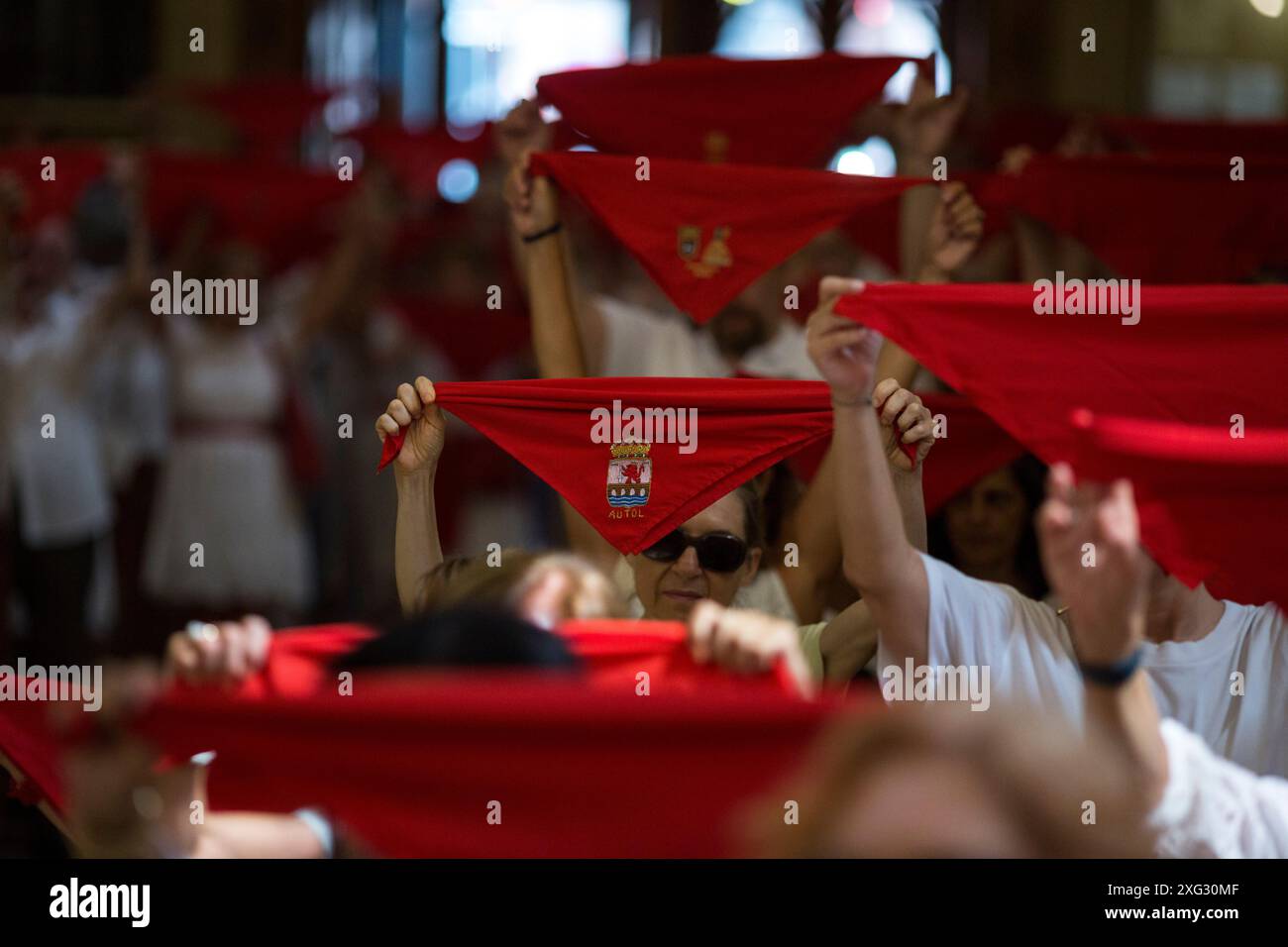 Madrid, Madrid, Spain. 6th July, 2024. People hold red scarves high to be blessed by the priest ...