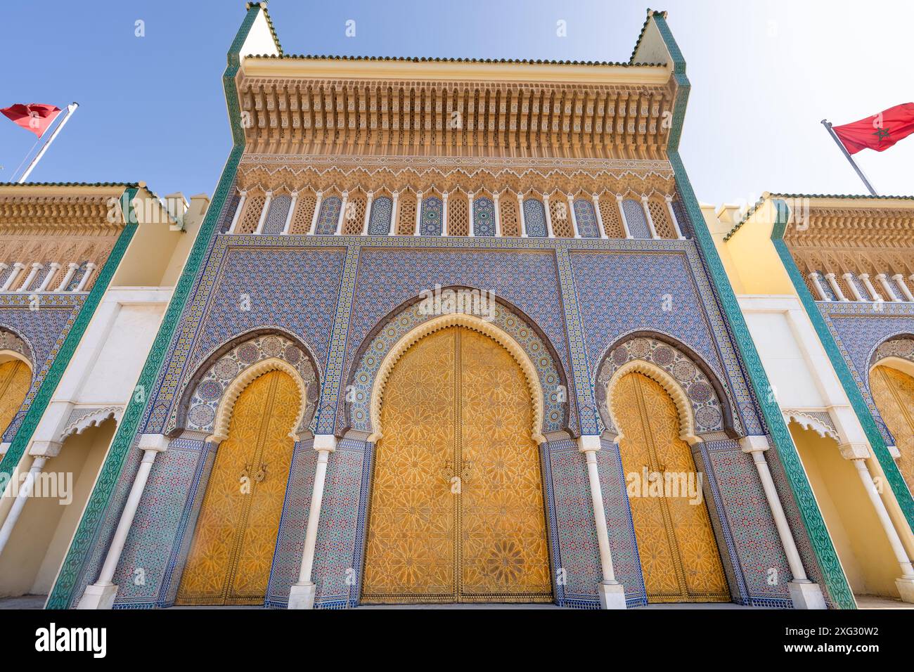 Golden gates of the Royal Palace in Fes, adorned with intricate Islamic ...