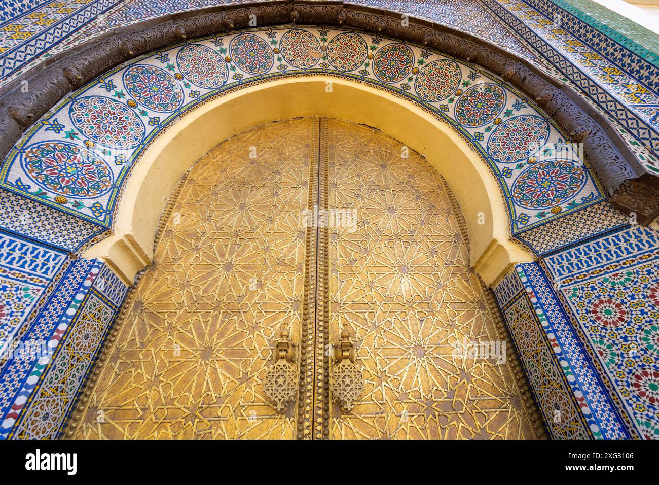 Golden gates of the Royal Palace in Fes, adorned with intricate Islamic ...